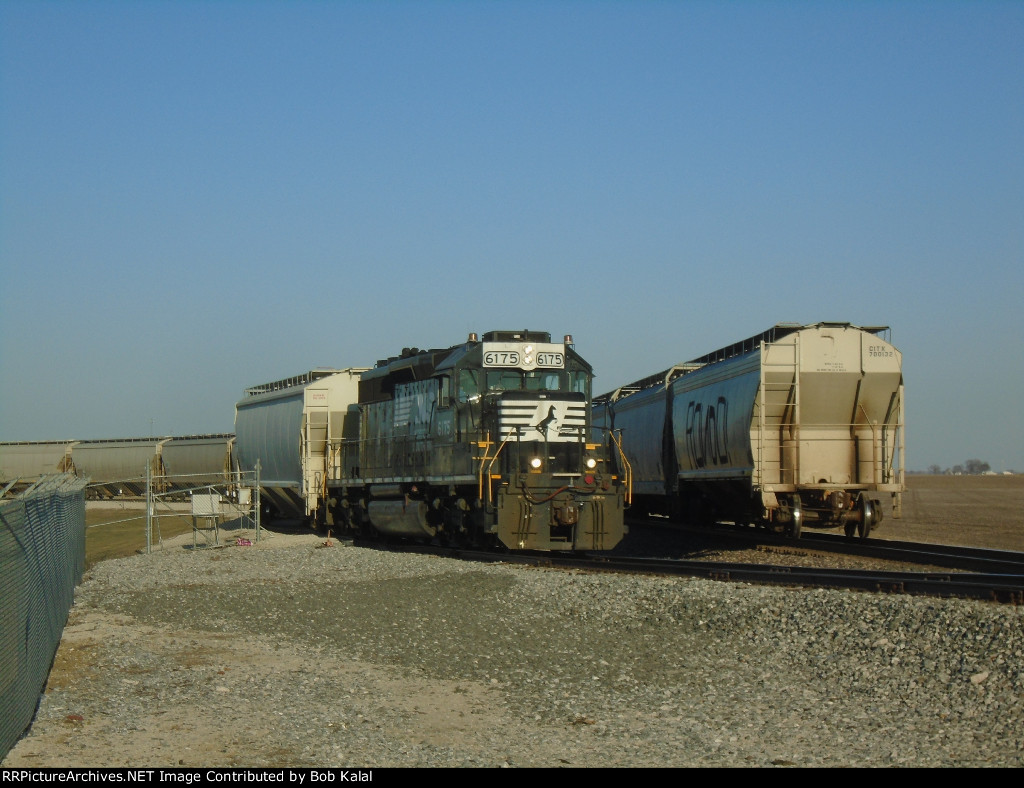 NS 6175 backs into Frito Lay spur to drop off the 13 cars. just inside the gate, & uncouples ...